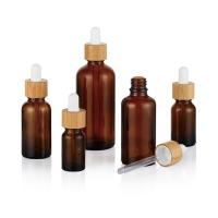 China 10ml-100ml Essential Oil Bottle 50ml Bamboo Lid White Porcelain/Amber Platinum Essential Oil Bottle Anti-theft Cap for sale