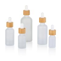 China 10ml-100ml Essential Oil Bottle 50ml Bamboo Lid White Porcelain/Amber Platinum Essential Oil Bottle Anti-theft Cap for sale