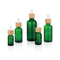 China 10ml-100ml Essential Oil Bottle 50ml Bamboo Lid White Porcelain/Amber Platinum Essential Oil Bottle Anti-theft Cap for sale