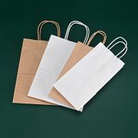 China Custom Thickened Paper Gift Bag for Clothing Store Takeaway 100pcs per Bag for sale