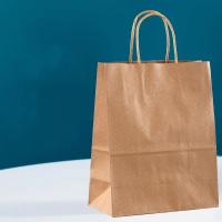 China Takeaway Packaging Kraft Paper Bag with Customized Logo Printing and Hand-Held Design for sale
