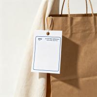 China Custom Synthetic Paper Hang Tags for Clothing Bedding Set, Gold Embossed Biodegradable Printed Swing Tag for sale