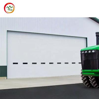 China Industrial Vertical Lift Overhead Steel Workshop Door with Transparent Windows - 450-550mm Panel Height, 600-1200N Motor Force for sale