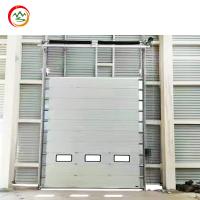 China Industrial Vertical Overhead Sectional Warehouse Dock Door 450mm-550mm Panel Height with 600N-1200N Motor Options for sale