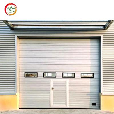 China Vertical Sectional Overhead Industrial Automatic Sliding Door with 600N-1200N Motor Force and 450-550mm Panel Height for sale