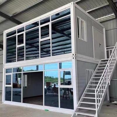 China Flat Pack Container House 20ft 40ft EPS Rockwool Sandwich Panel Portable Cabin Bungalow Kit for sale