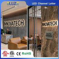 China Matt Black Painted Metal Shell Warm White Halo Lit LED Signage With Standoffs For Corporate Office Lobby for sale