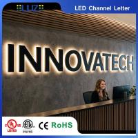 China Matt Black Painted Metal Shell Warm White Halo Lit LED Signage With Standoffs For Corporate Office Lobby for sale