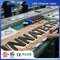 China Matt Black Painted Metal Shell Warm White Halo Lit LED Signage With Standoffs For Corporate Office Lobby for sale