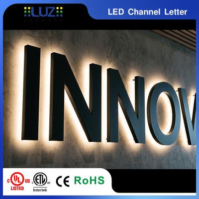China Matt Black Painted Metal Shell Warm White Halo Lit LED Signage With Standoffs For Corporate Office Lobby for sale