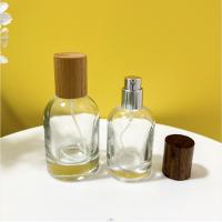 China Bamboo Wooden Cap Small Glass Perfume Spray Bottles 30ml 50ml 100ml for sale