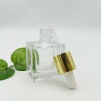 China 30 Ml 35 Ml Essential Oil Container Glass Flat Shoulder Transparent Dropper Bottle for sale