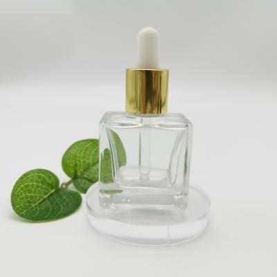 China 30 Ml 35 Ml Essential Oil Container Glass Flat Shoulder Transparent Dropper Bottle for sale