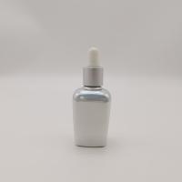 China Cosmetic Skincare Container Round Clear Glass Essential Oil Serum Dropper Bottles for sale