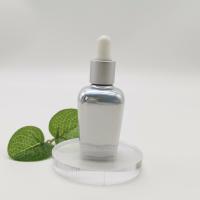 China Cosmetic Skincare Container Round Clear Glass Essential Oil Serum Dropper Bottles for sale
