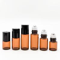 China Cylinder Amber Glass Roll On Bottles 2ml 3ml 5ml Rollerball Perfume Container for sale