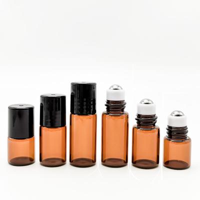 China Cylinder Amber Glass Roll On Bottles 2ml 3ml 5ml Rollerball Perfume Container for sale
