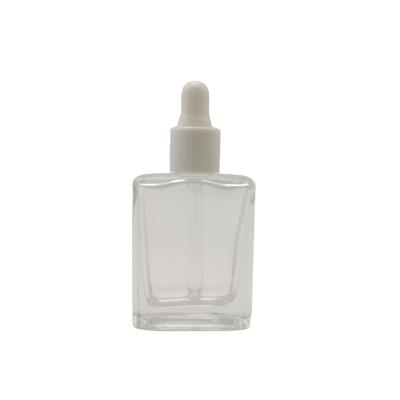 China Square Transparent Cosmetic Glass Lotion Bottles With Dropper 1oz 2oz for sale