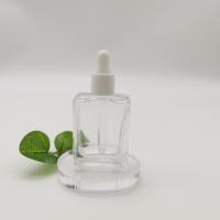 China Square Transparent Cosmetic Glass Lotion Bottles With Dropper 1oz 2oz for sale