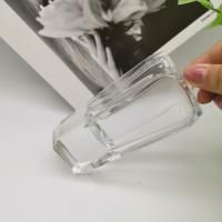 China Flat Shoulder Clear Glass Perfume Spray Bottles 30ml 50ml 100ml for sale