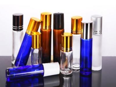 China Red Blue Green Colored Glass Roller Ball Bottles 10ml 15ml Plastic Cap for sale