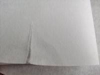 China Gaoxin 100% Polyester Backing Paper Cutaway Adhesive Stabilizer Embroidery Interlining for sale