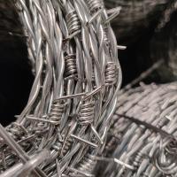 China 1.7mm Barbed Wire Prison Fence 350kgf Coiled Barbed Wire Fencing for sale