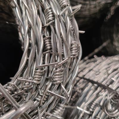 China 1.7mm Barbed Wire Prison Fence 350kgf Coiled Barbed Wire Fencing for sale