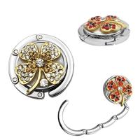 China Custom Logo Metal Folded Round Purse Hooks Colored Diamond Clover Bag Hanger for sale
