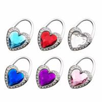 China Custom Purse Hook foldable bag holder Folding Beautiful Heart Hanging Bag Hanger for sale