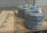 China PVC Coated Double Strand Barbed Wire Galvanized 2.51mm Silver Color for Farm Security for sale
